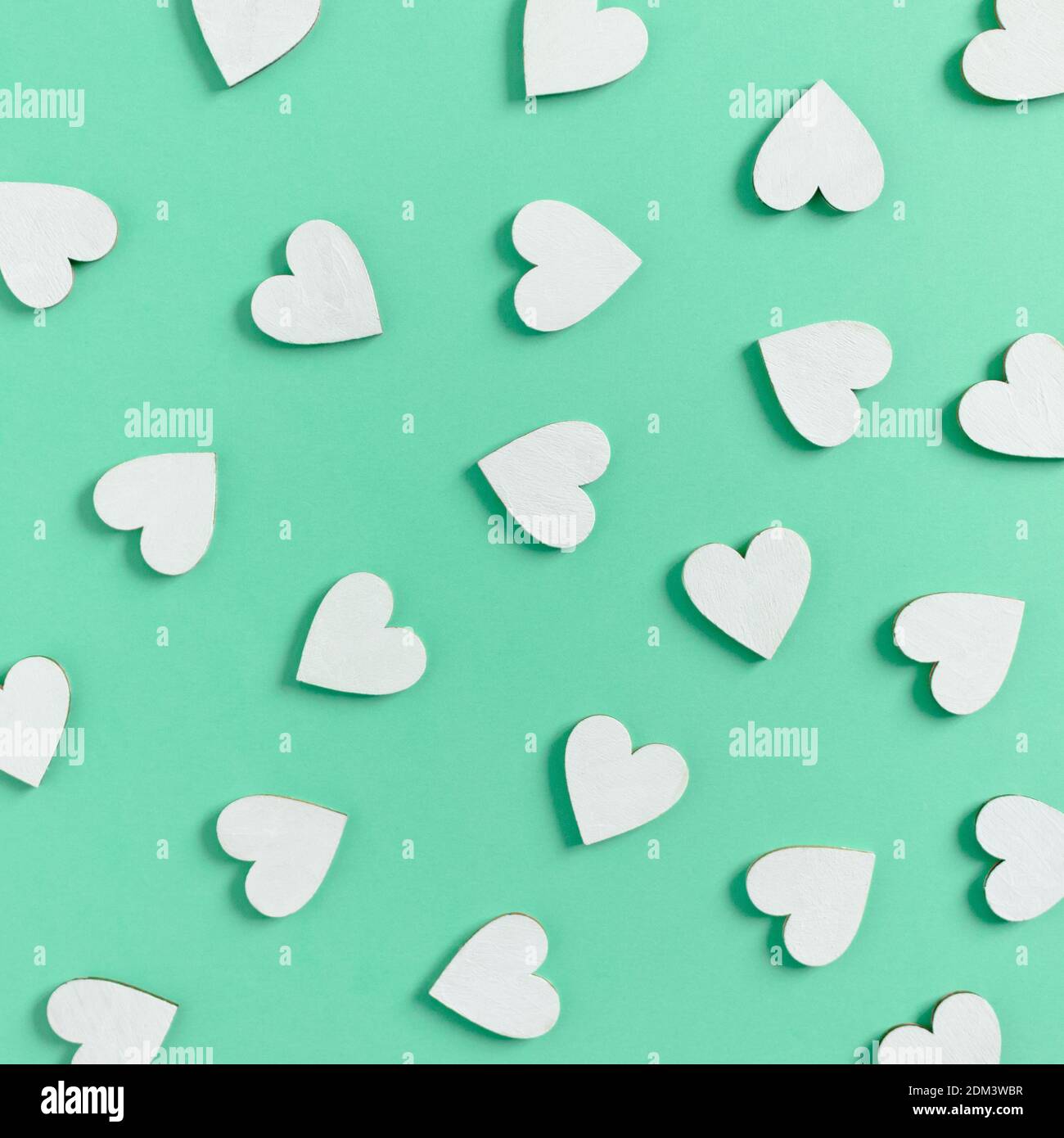 Pattern made of white hearts on mint background Stock Photo - Alamy