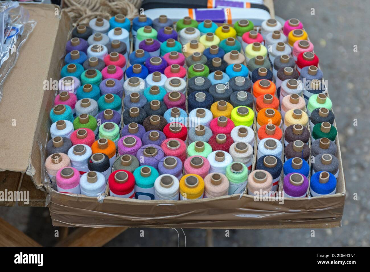 Big Box of Colourful Sewing Thread Reels Stock Photo - Alamy