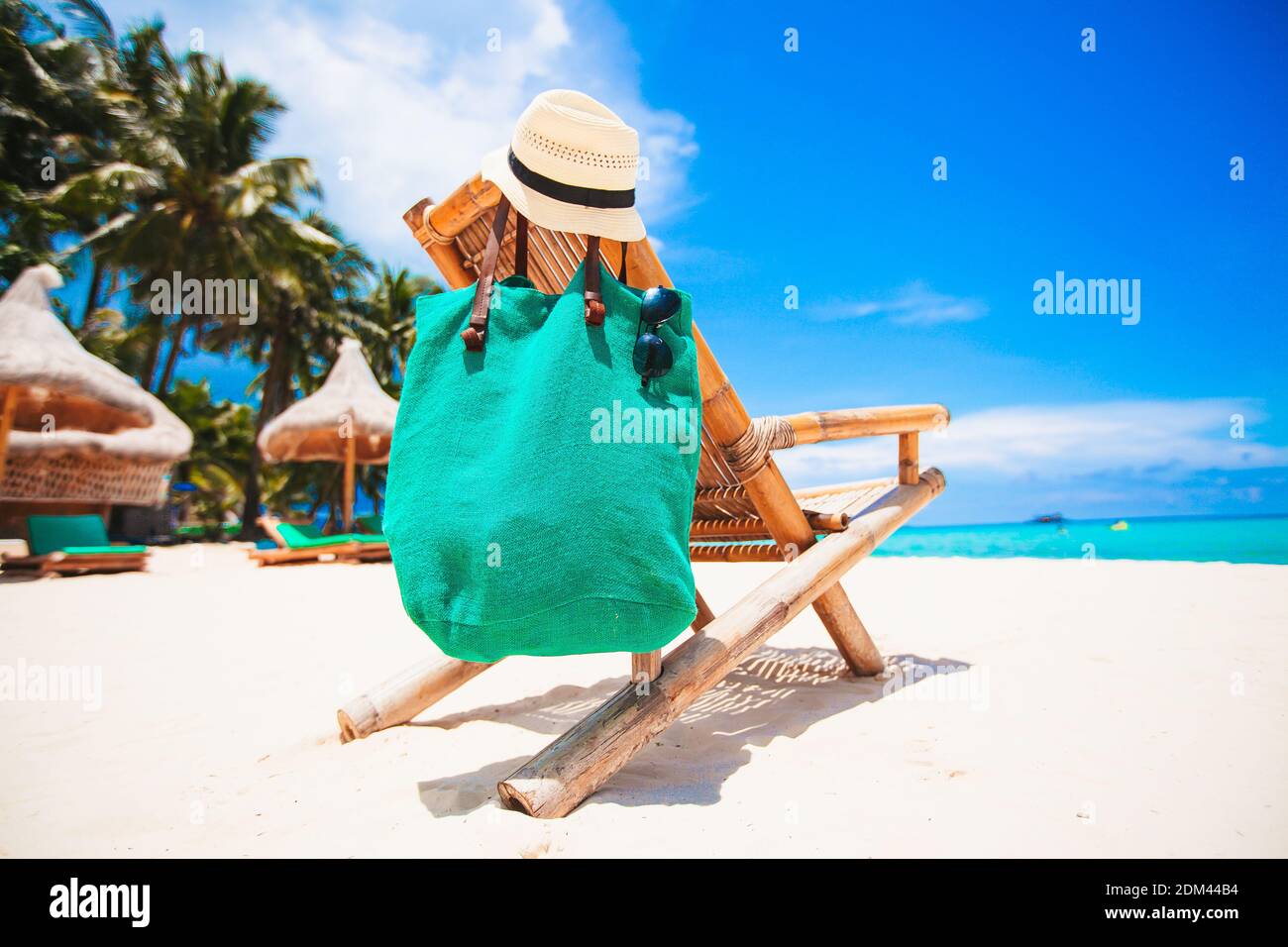 White lounge chairs on a beautiful tropical beach Stock Photo - Alamy