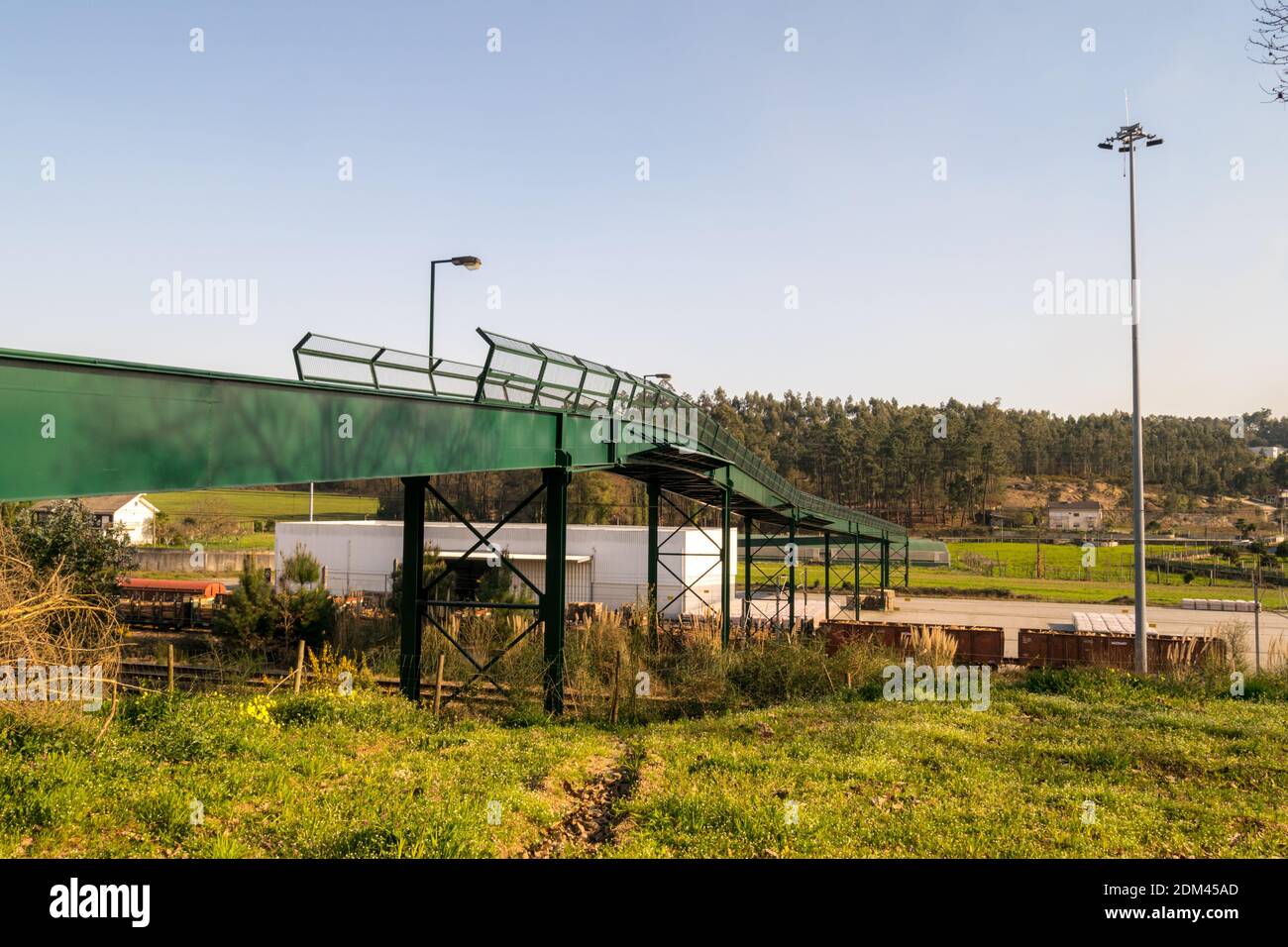 Green steel Bridge over train line Stock Photo - Alamy