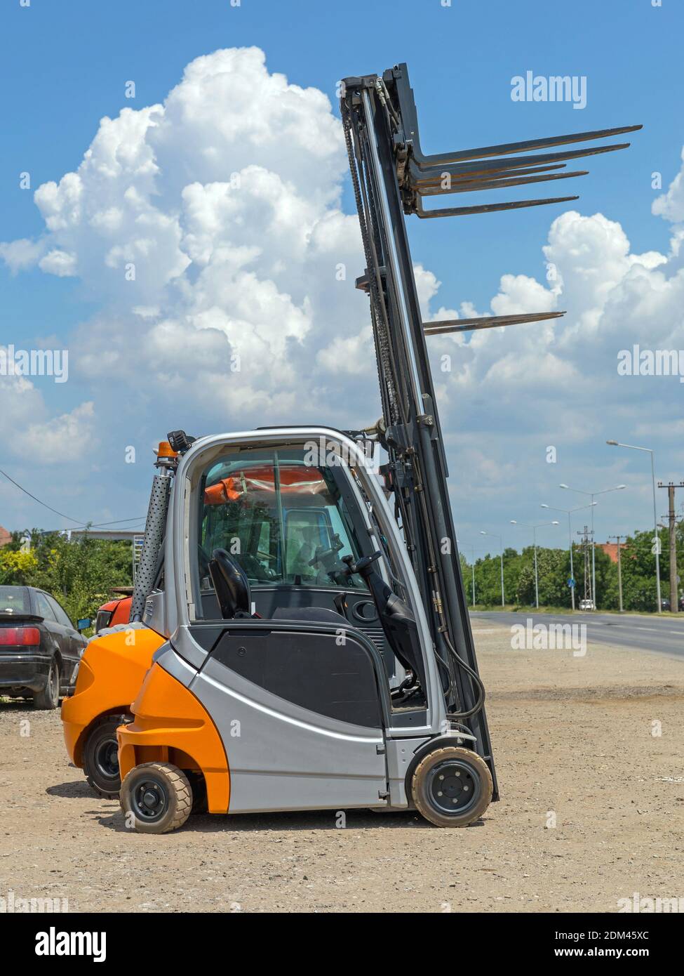 Small Forklift Truck With Cabin Forks Up Stock Photo - Alamy