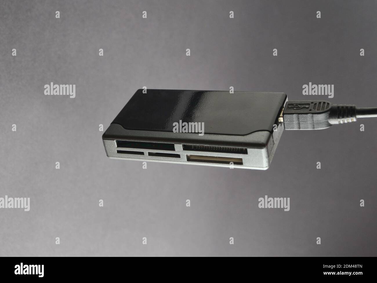 USB card reader on a gray background Stock Photo - Alamy