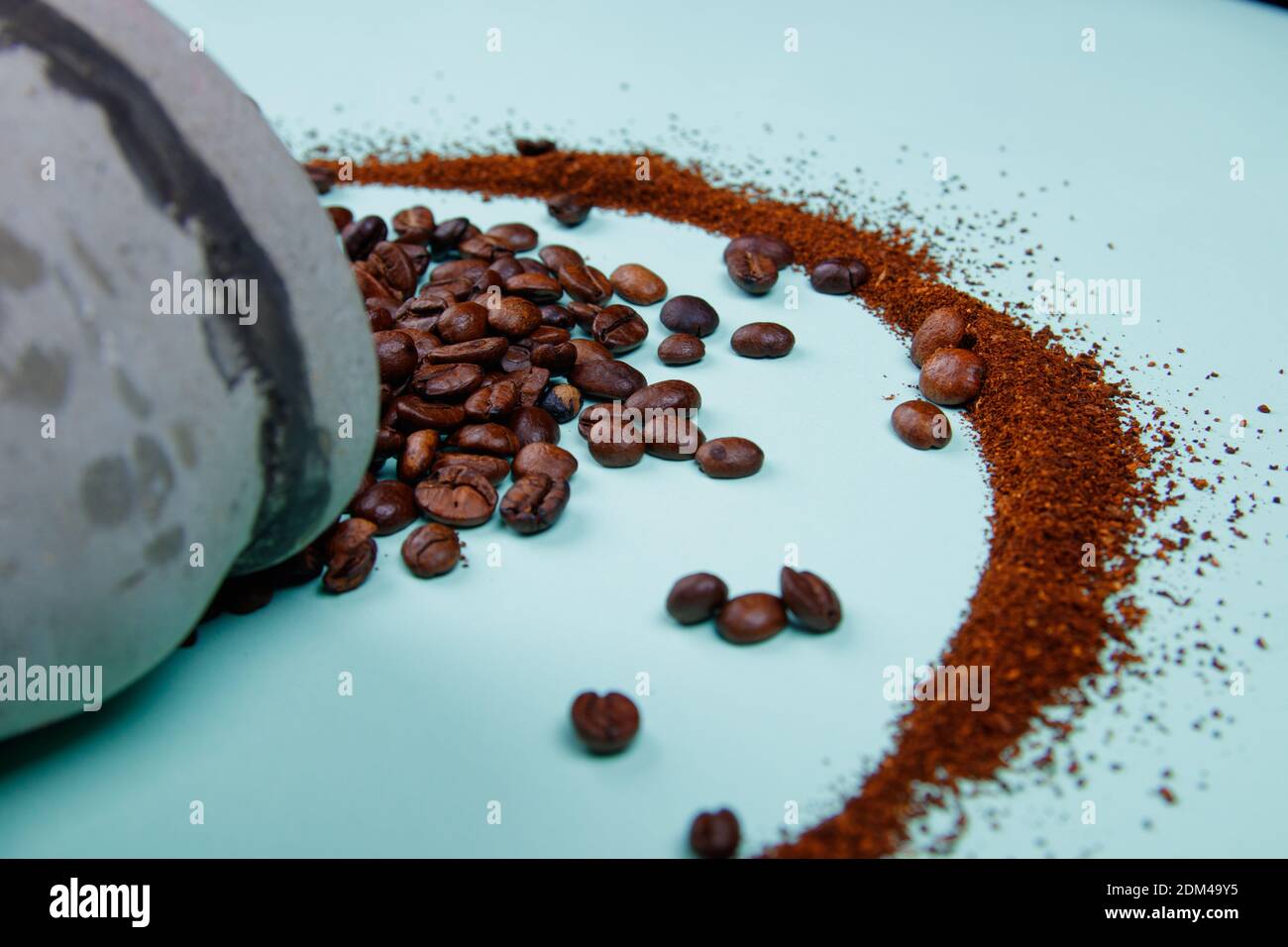 Roasted whole coffee grain on a mexican stone mortar surrounded by a ...
