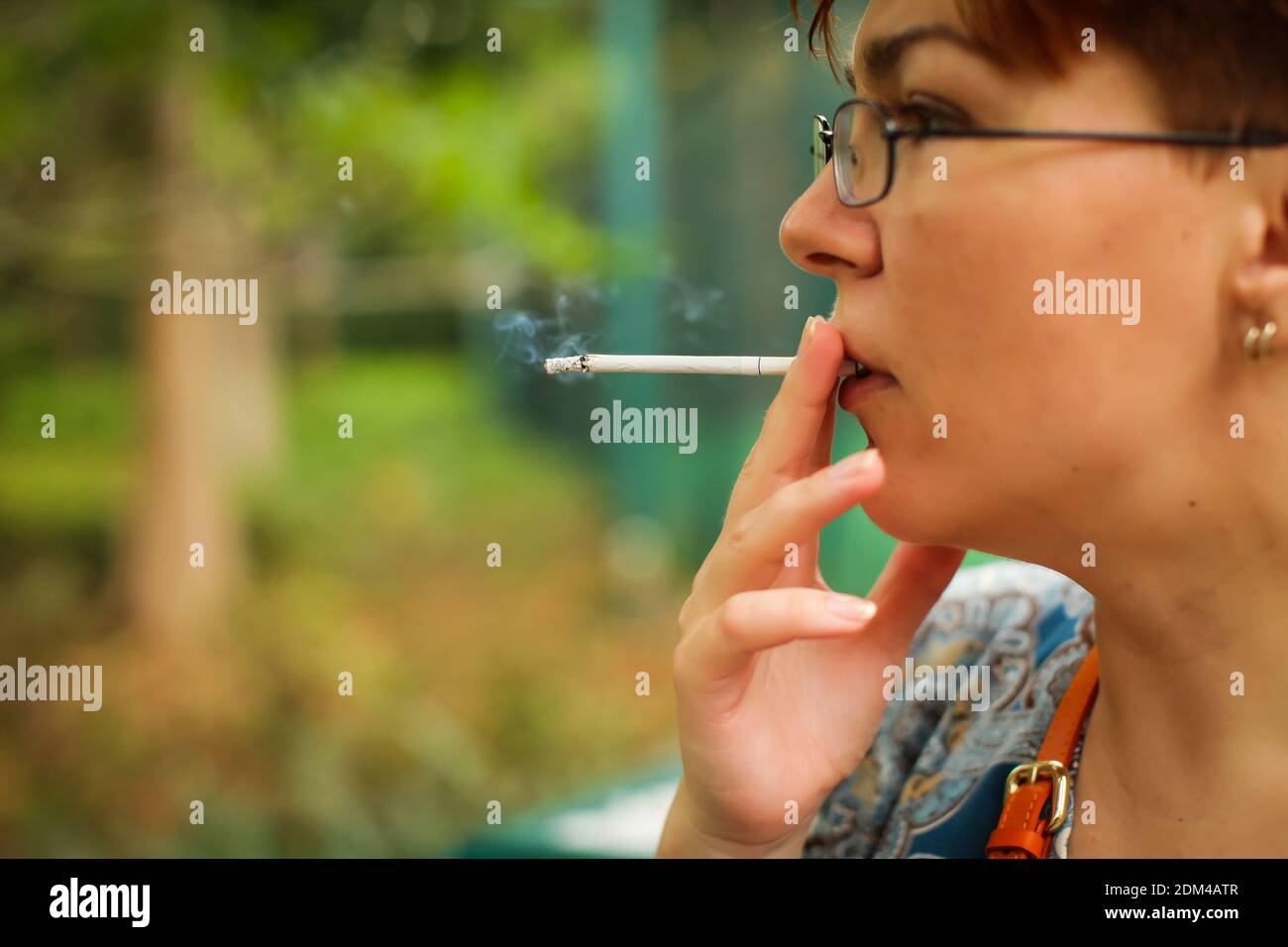 Woman Smoking Cigarette Exhaling Tobacco High Resolution Stock ...