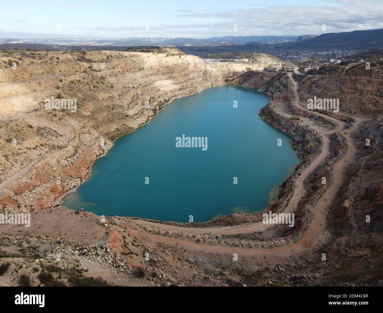Aerial view on Emerald lake in a flooded quarry. Emerald green lake in ...