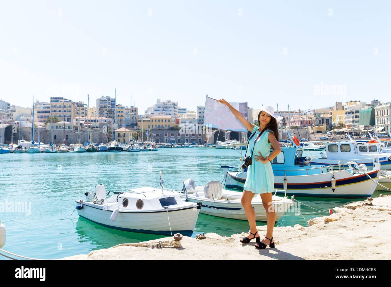 Smiling stylish girl at the Venetian port of Heraklion Crete Greece ...