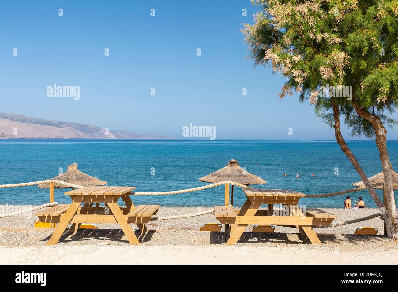 Seaside tables at the beach in Tavronitis, Crete, Greece Stock Photo ...