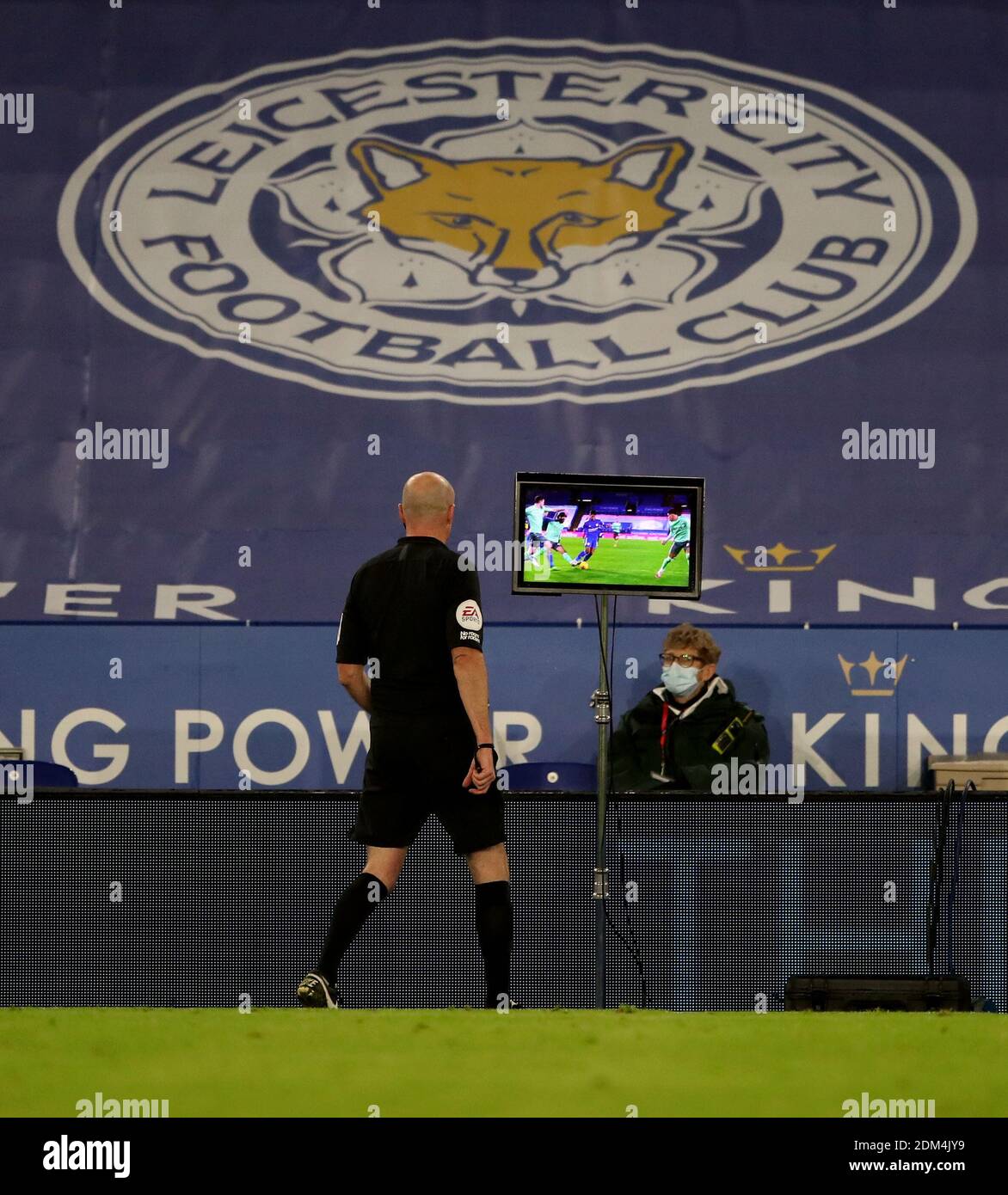 Referee Lee Mason reviews a penalty decision during the Premier League ...