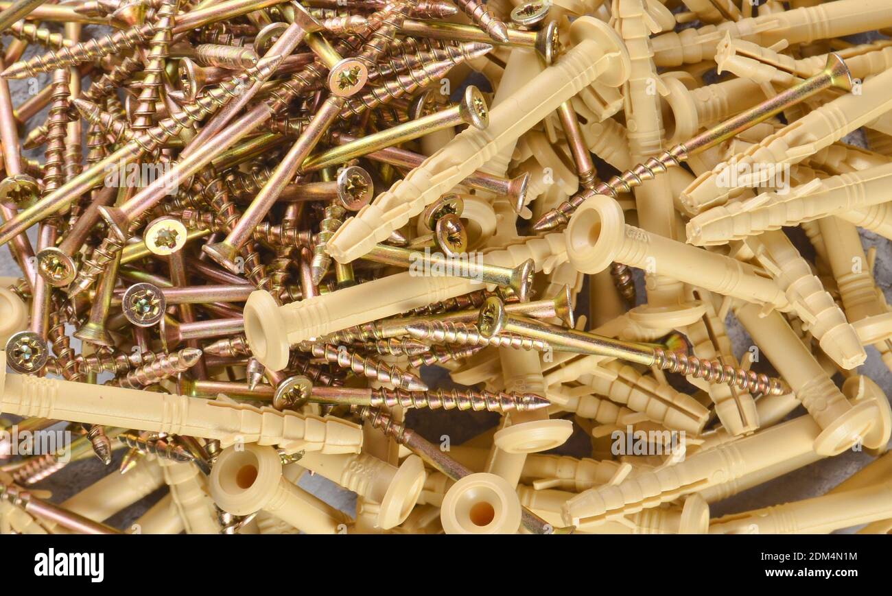 Background with dowel nails. Group of nail-plugs with plastic nails ...