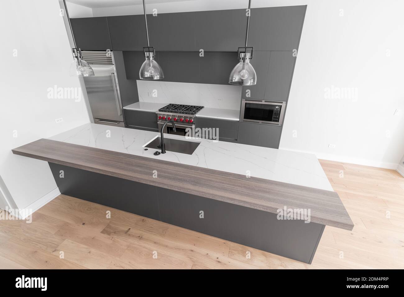 Overhead view of a modern kitchen with grey cabinets, Wolf and Sub-Zero ...
