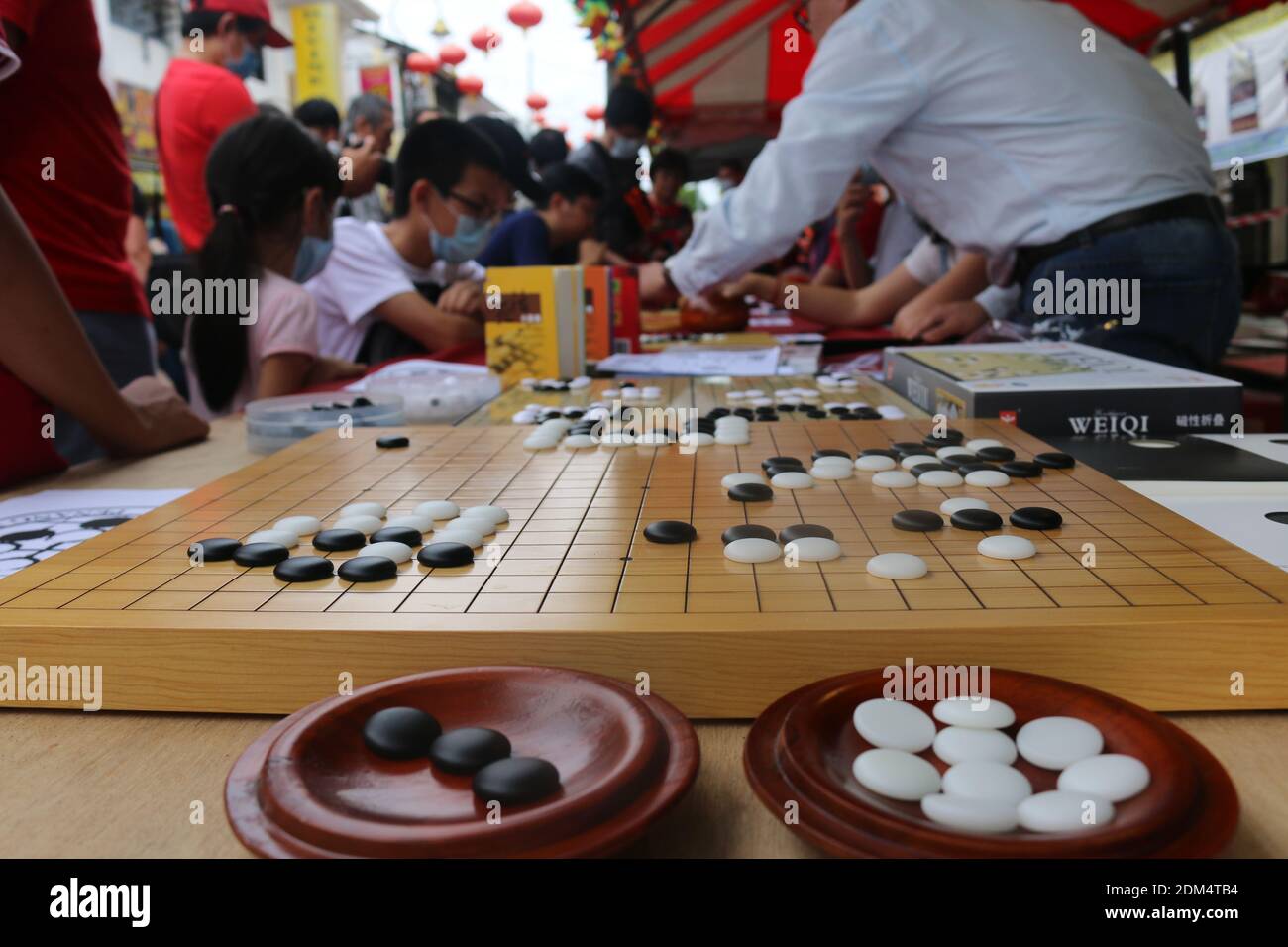 GEORGETOWN, MALAYSIA - Sep 04, 2020: Masked people playing the Chinese ...