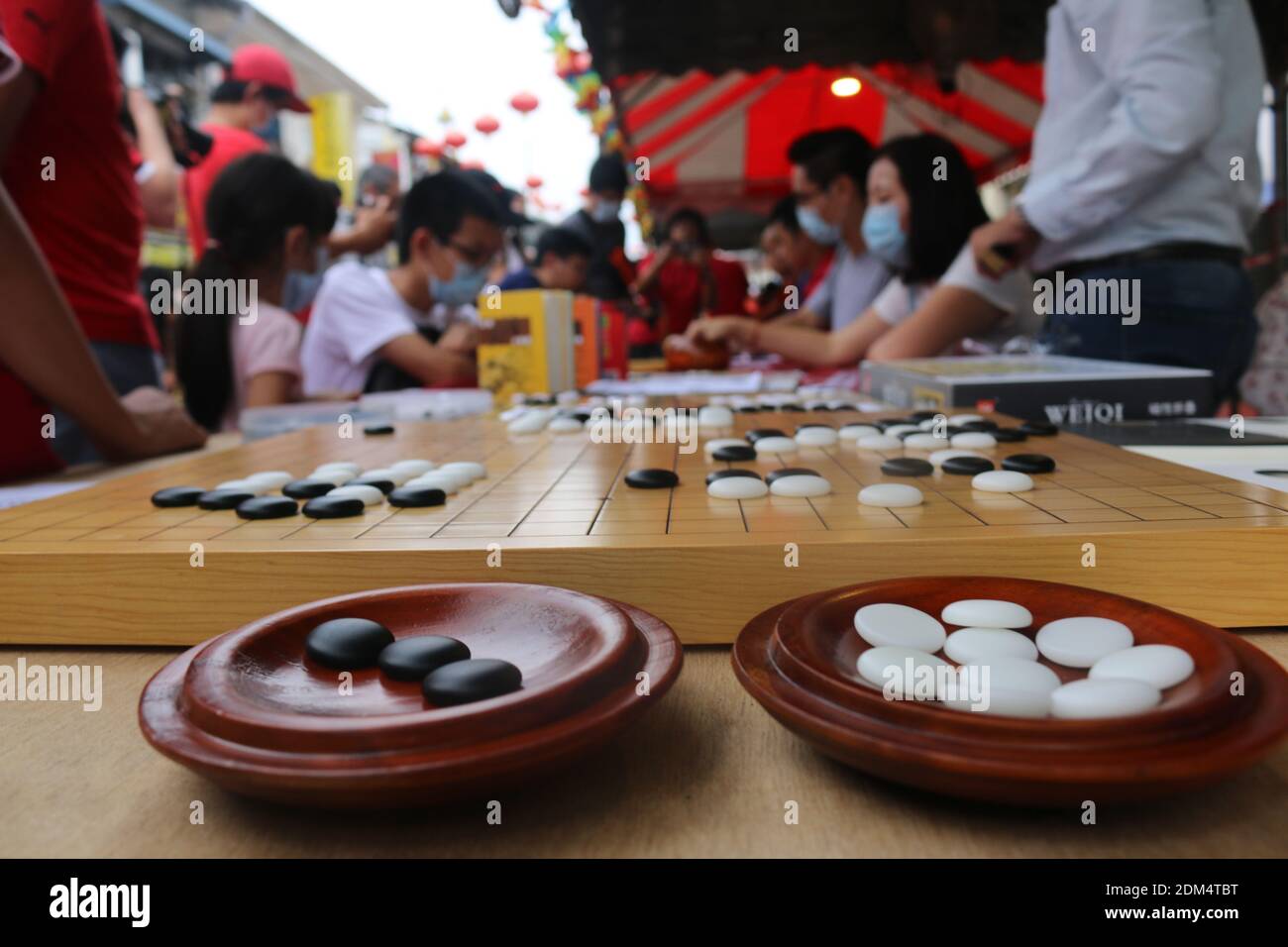 GEORGETOWN, MALAYSIA - Sep 04, 2020: Masked people playing the Chinese ...