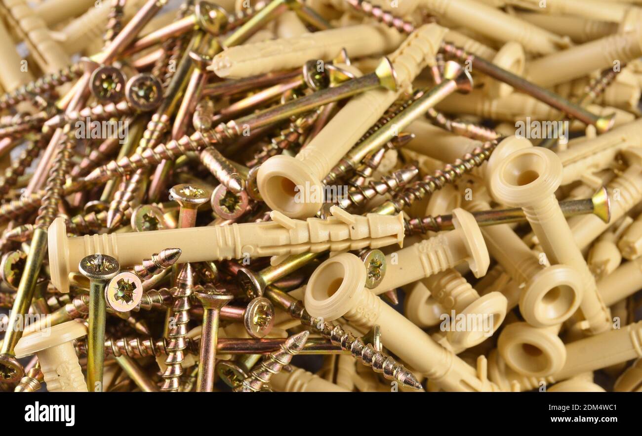 Background with dowel nails. Group of nail-plugs with plastic nails ...