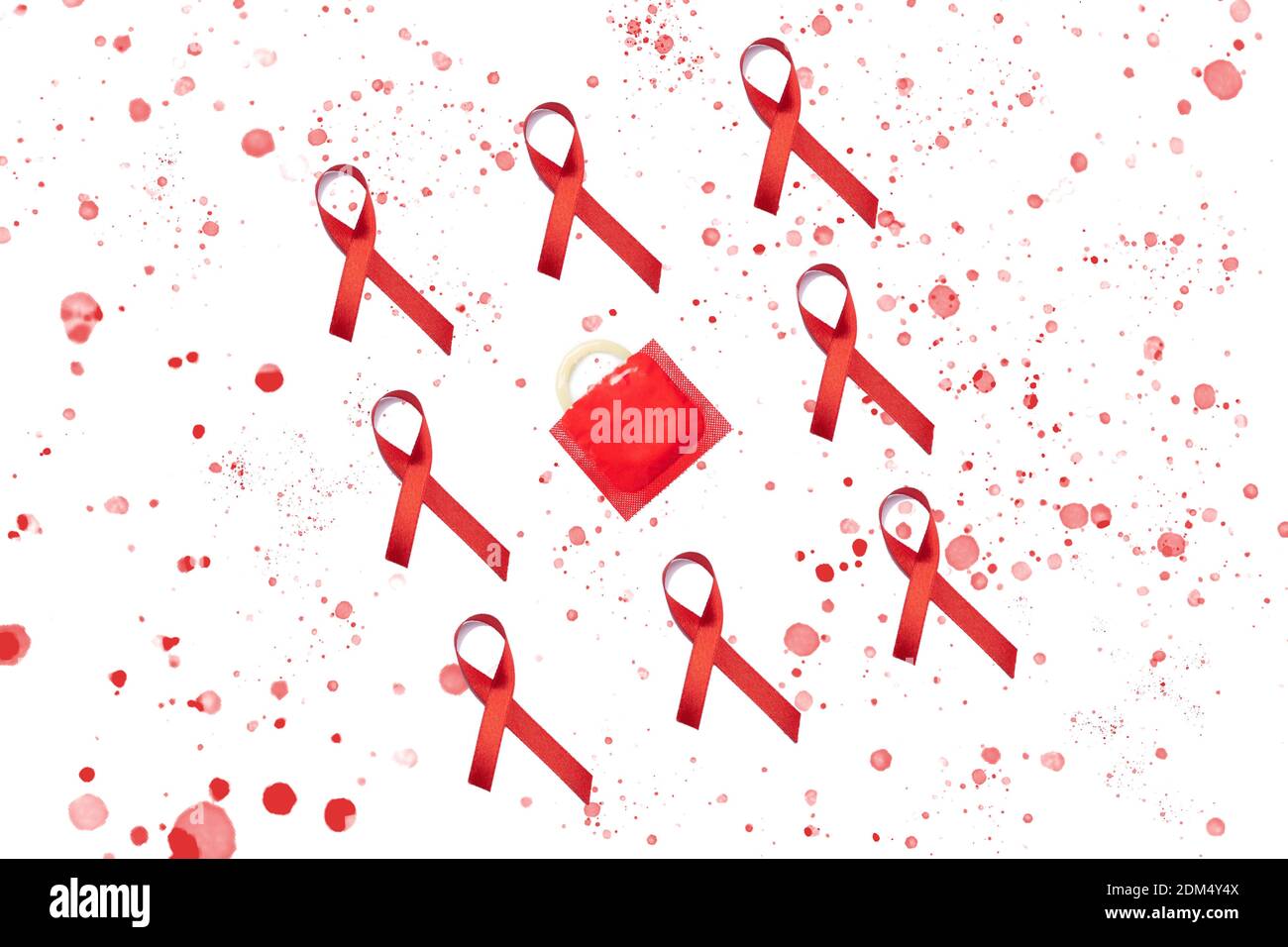 Red AIDS ribbon and condom with red splashes on white background. World ...