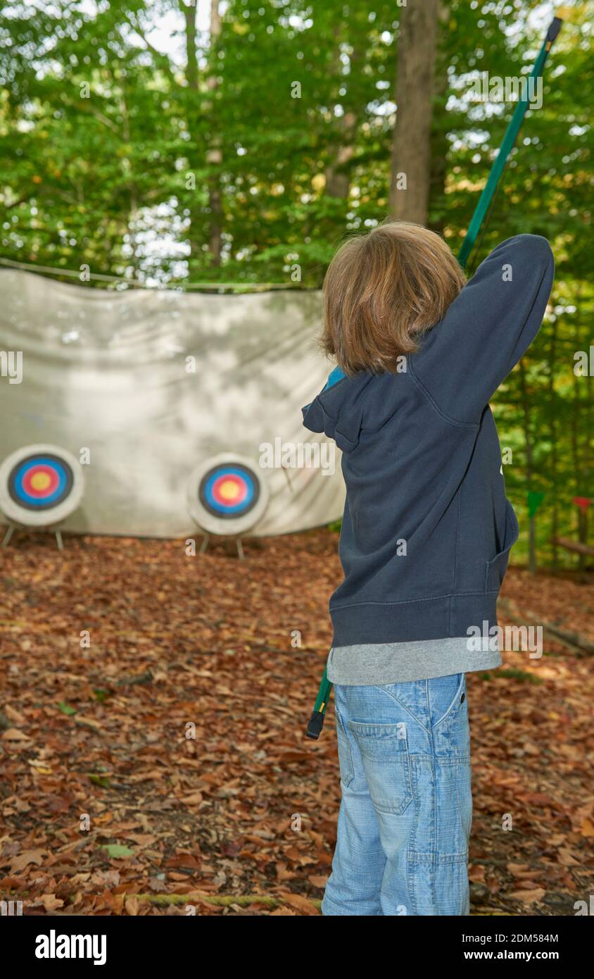 Boy shooting arrow hi-res stock photography and images - Alamy