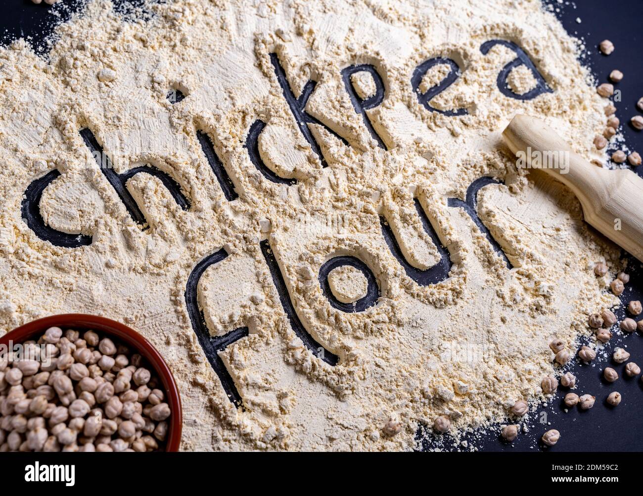 A top view closeup of the chickpeas and chickpea flour on the table ...