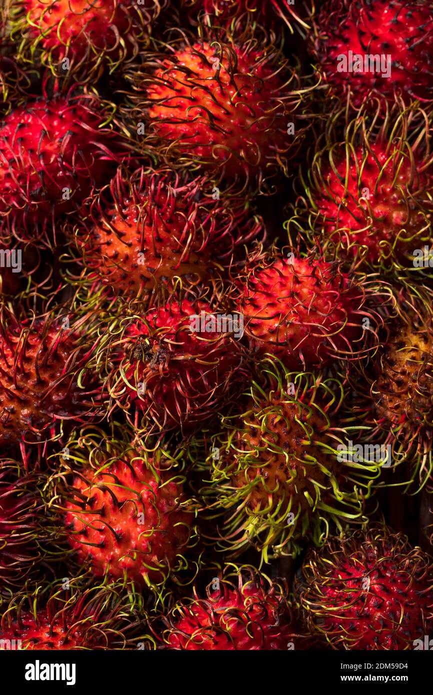 Raw Red Organic Rambutan Fruit Ready to Eat Stock Photo - Alamy