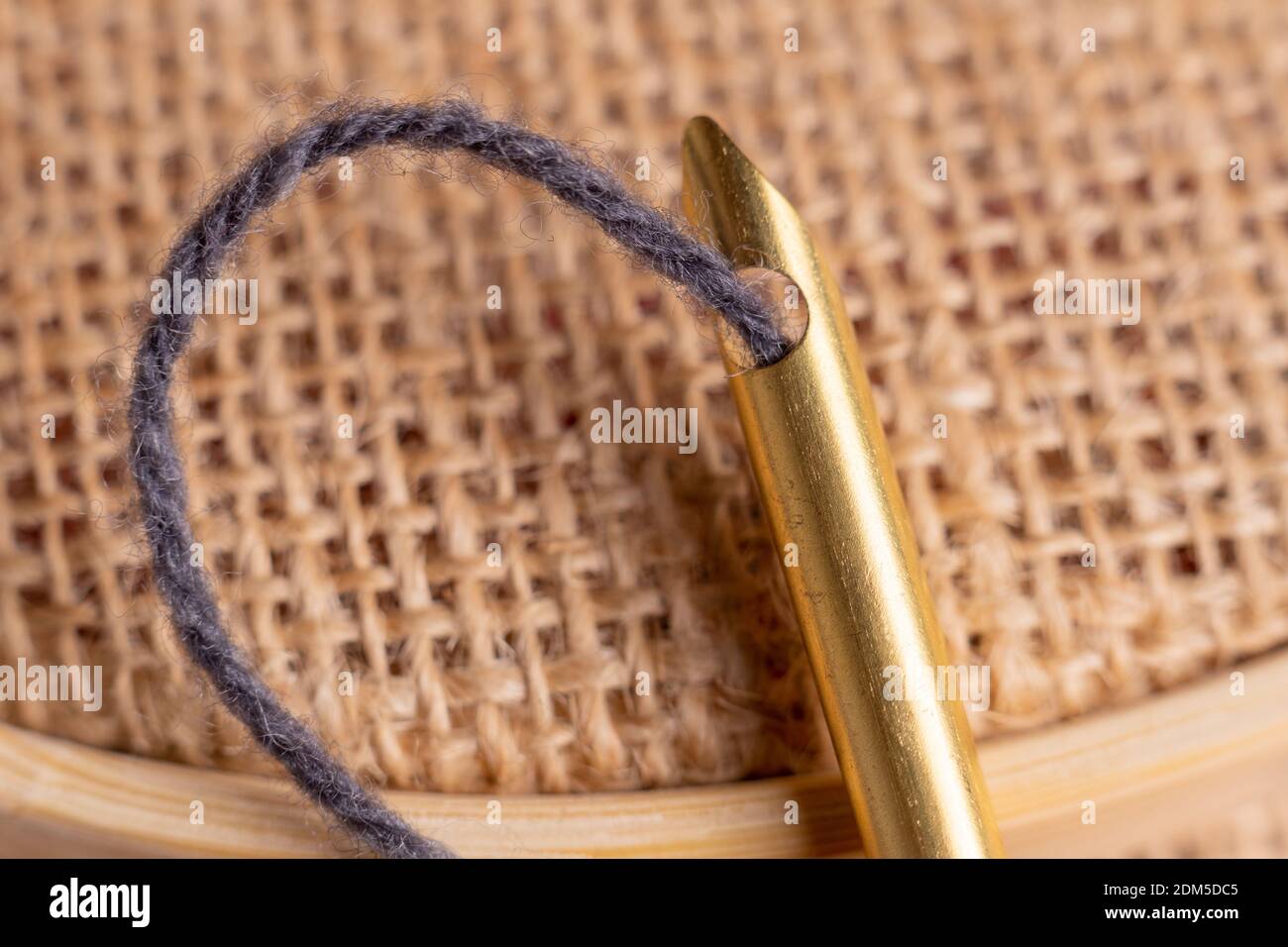 Flat lay composition of punch needle tools on a concrete surface in ...
