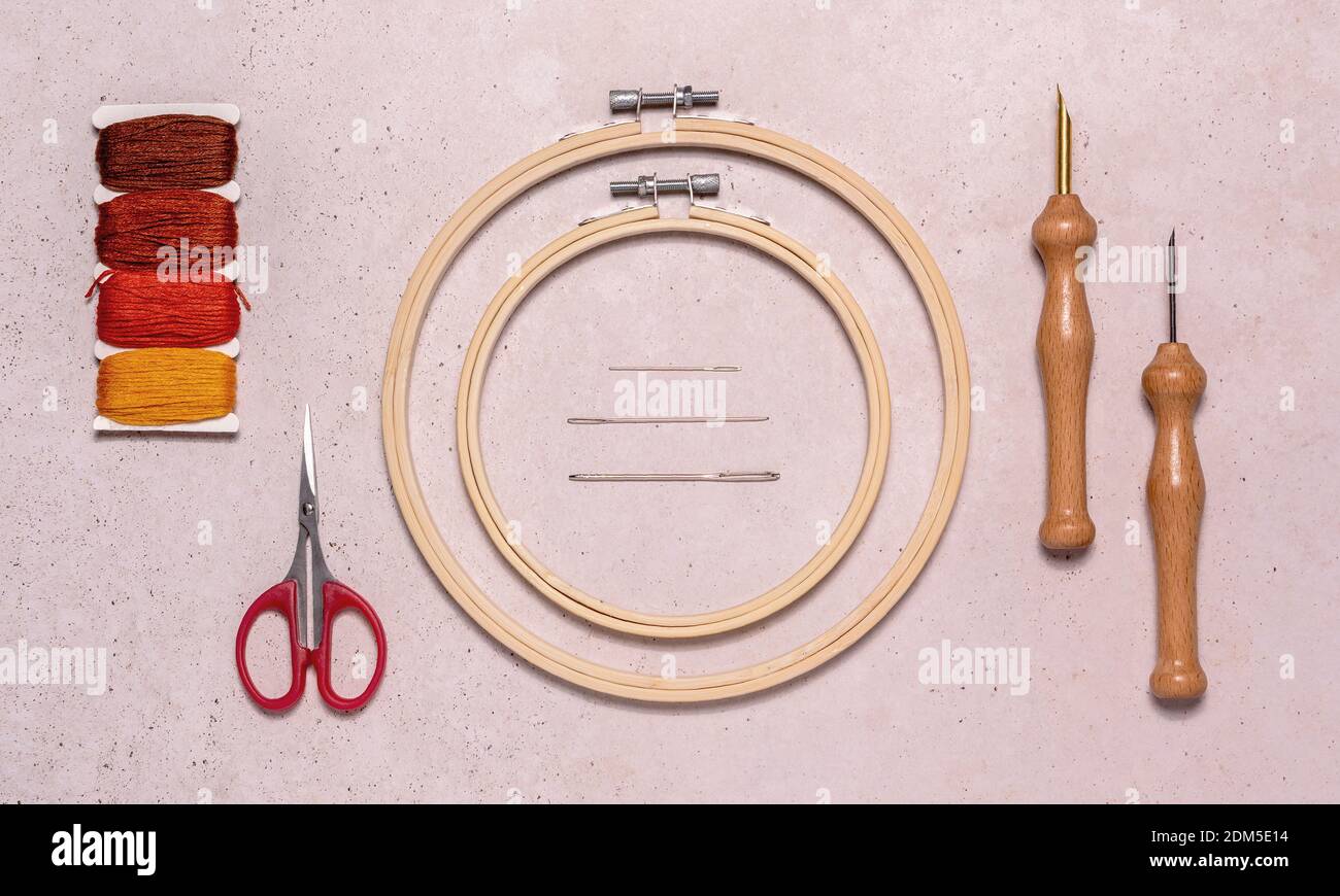 Flat lay composition of punch needle tools on a concrete surface in ...