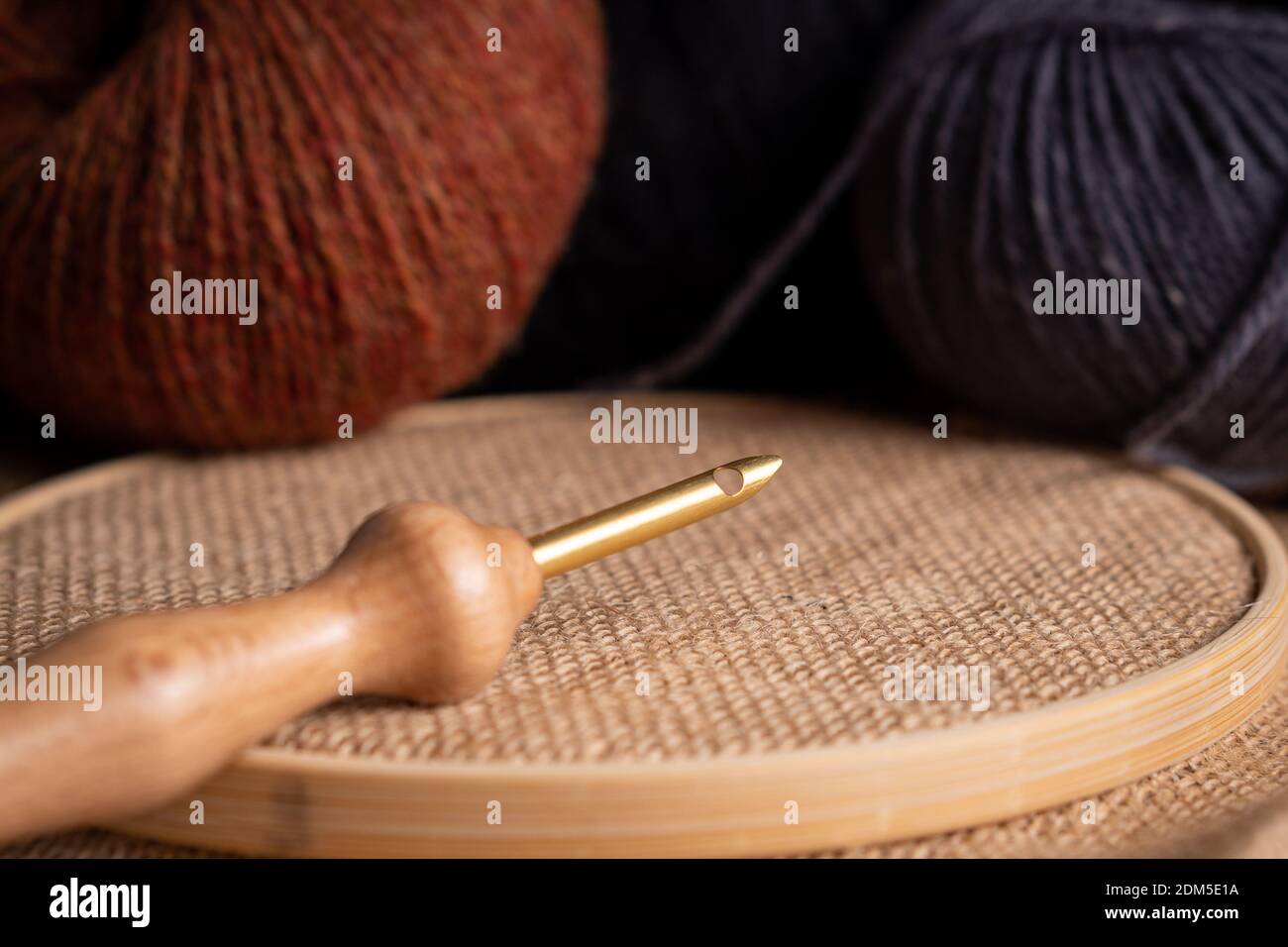 Flat lay composition of punch needle tools on a concrete surface in ...
