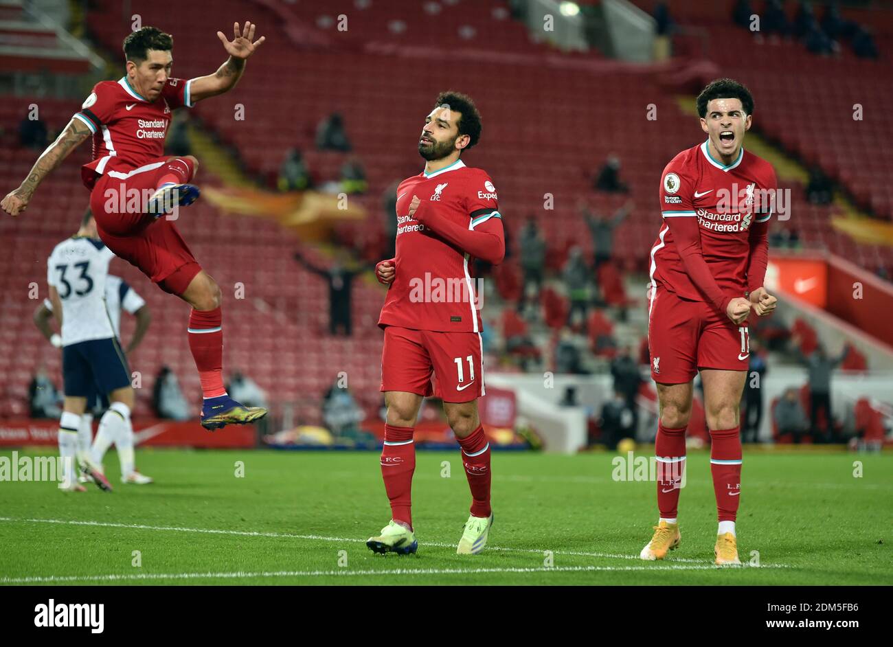 Liverpool's Mo Salah (centre) celebrates scoring his sides opening goal ...