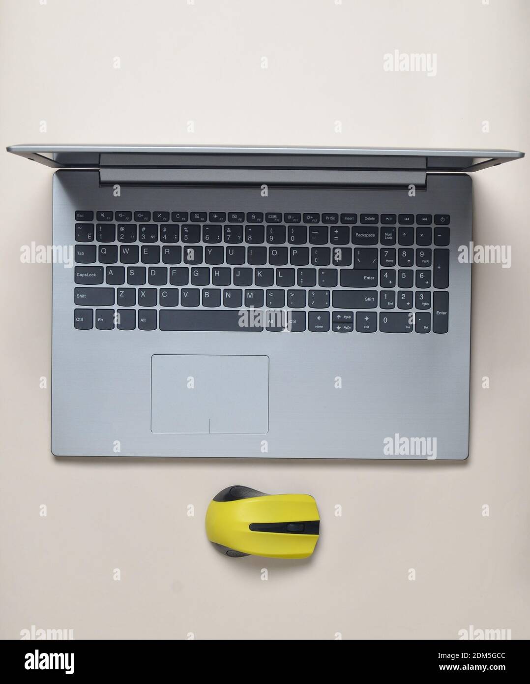 Modern laptop, wireless mouse on a pastel background, minimalism, top ...