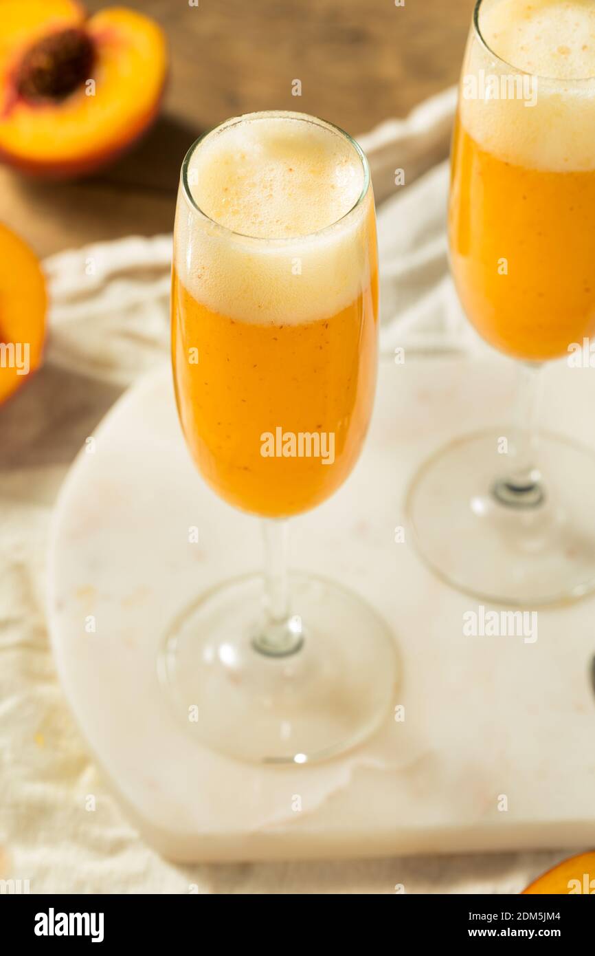Refreshing Boozy Peach Bellini Cocktail with Prosecco Stock Photo - Alamy