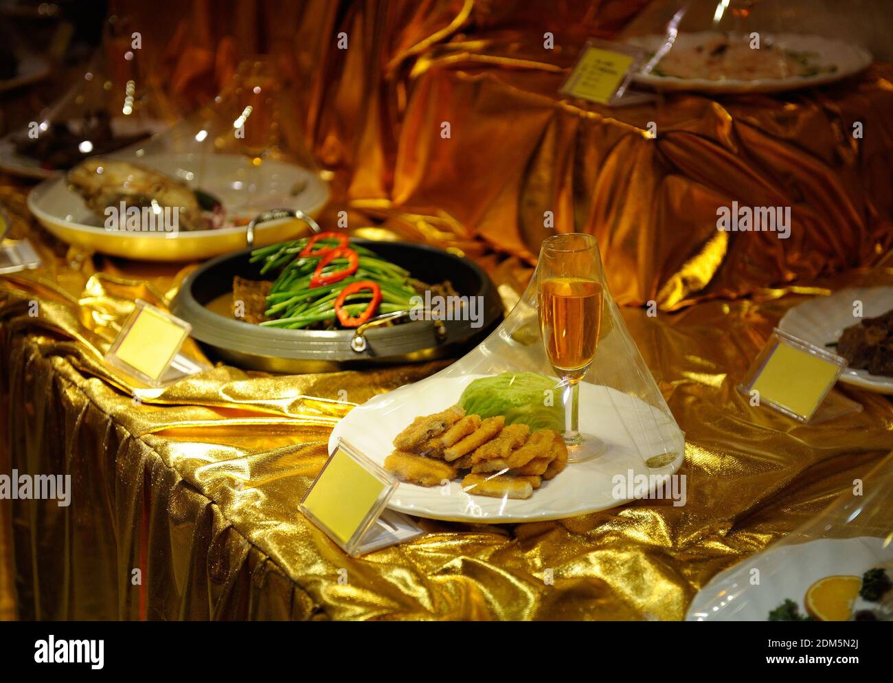 Collection of Chinese food sample dishes, enveloped with transparent ...