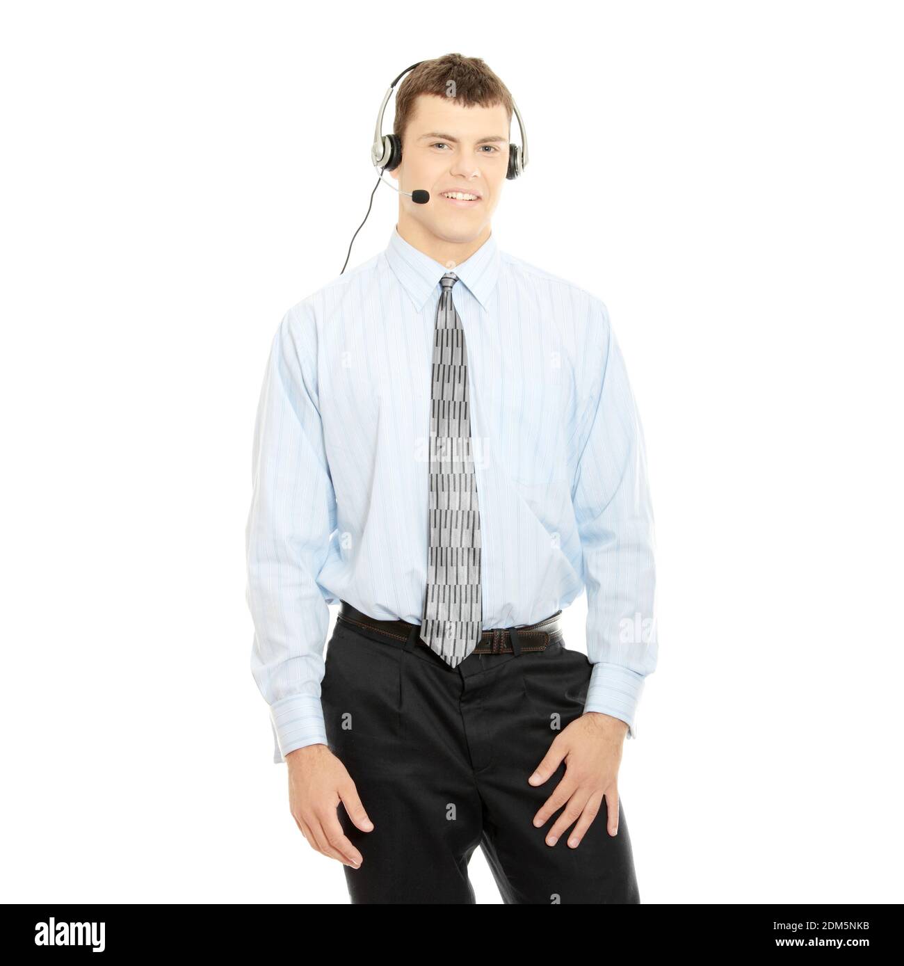 Portrait Of Customer Service Representative Standing Against White ...