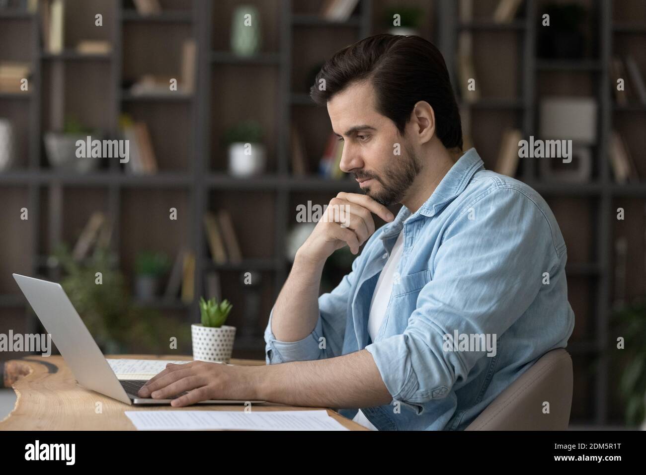 Pensive Caucasian man work on computer thinking Stock Photo - Alamy
