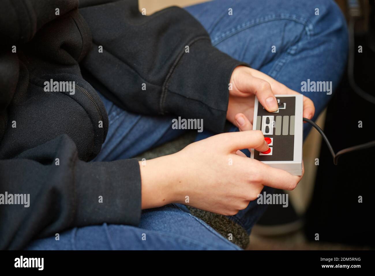 Playing an old gaming console Stock Photo - Alamy