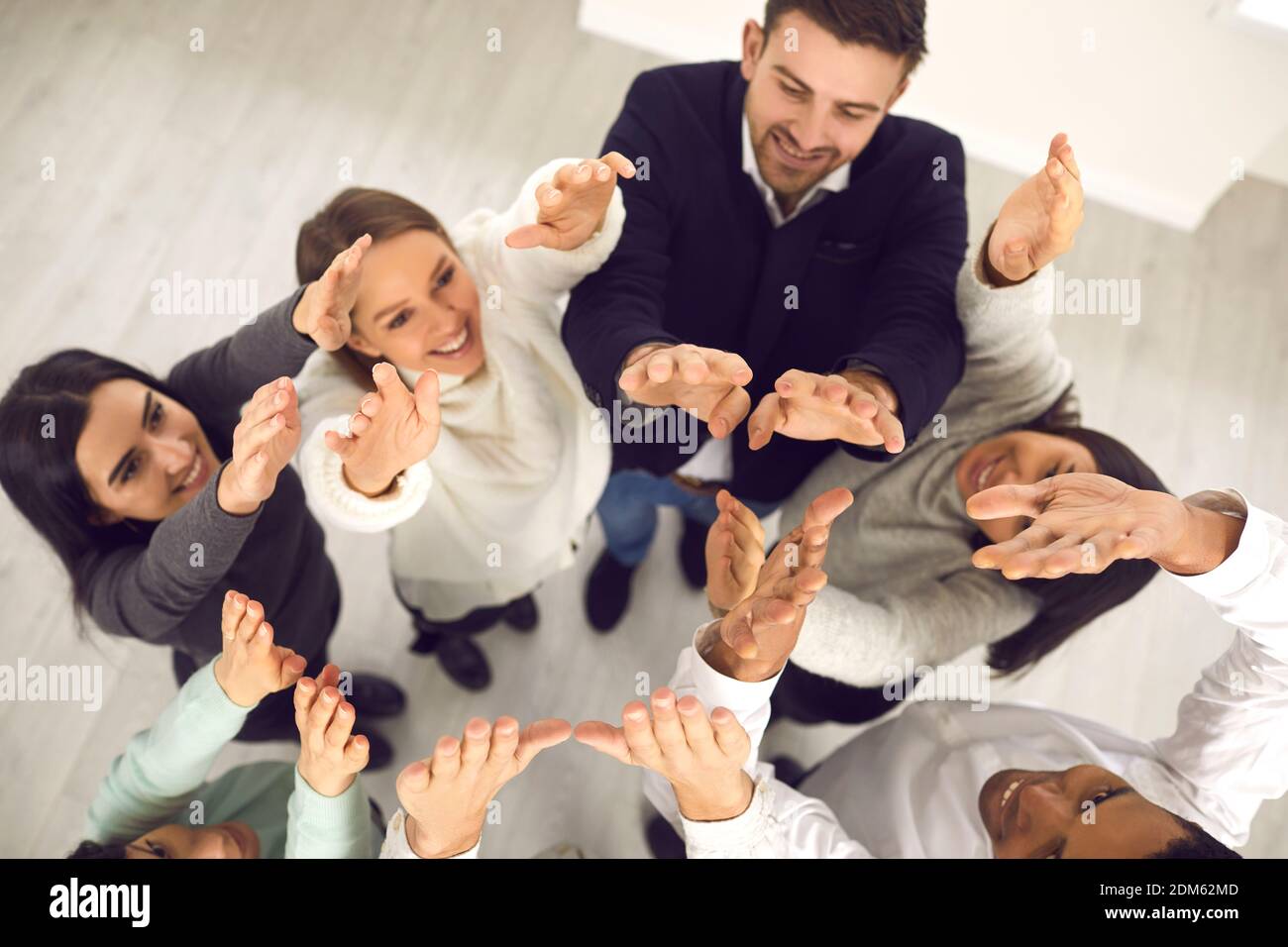 Business people raising hands up in air, illustrating concept of team ...