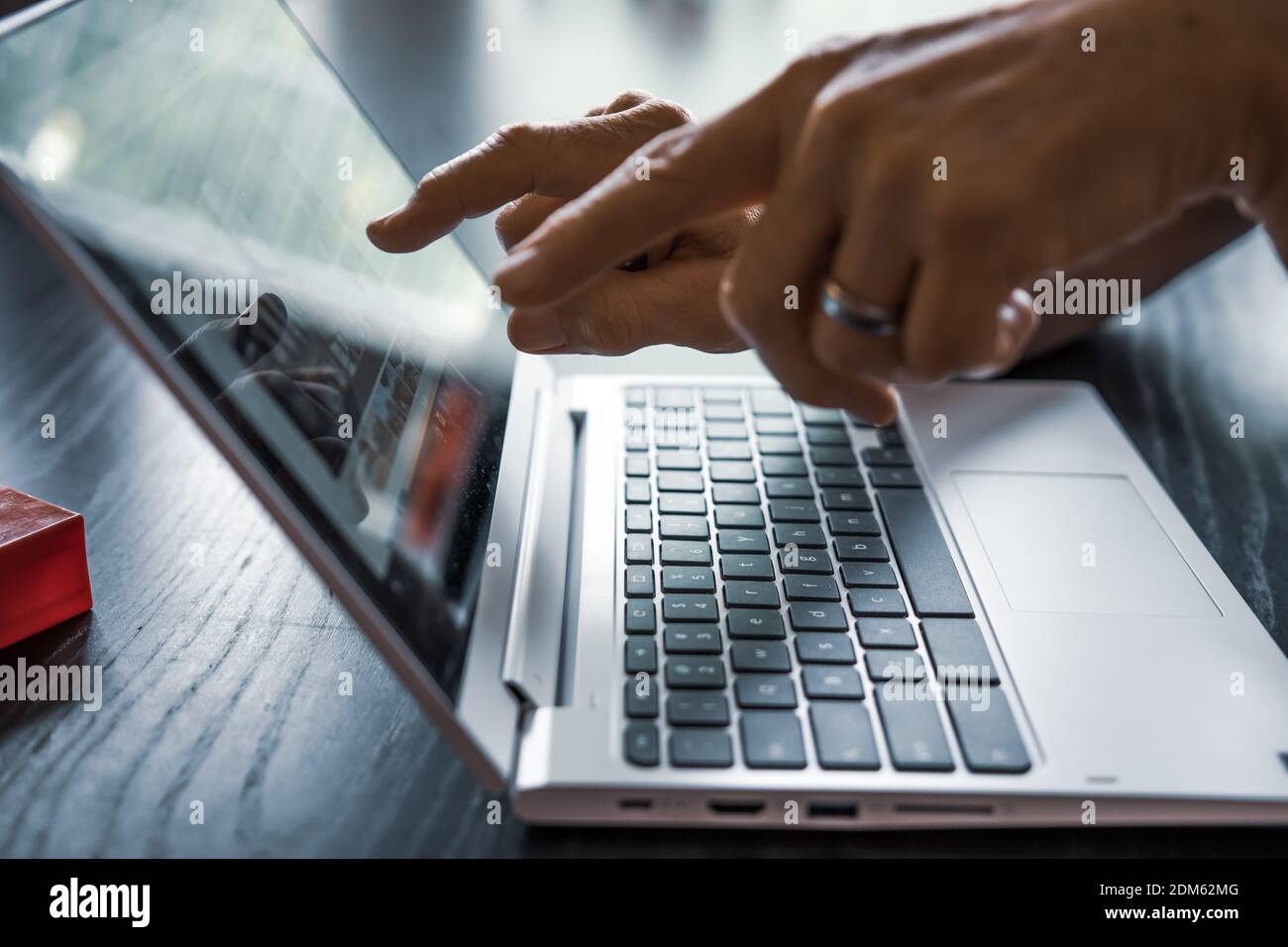Mature, white male uses modern touch screen laptop computer Stock Photo ...