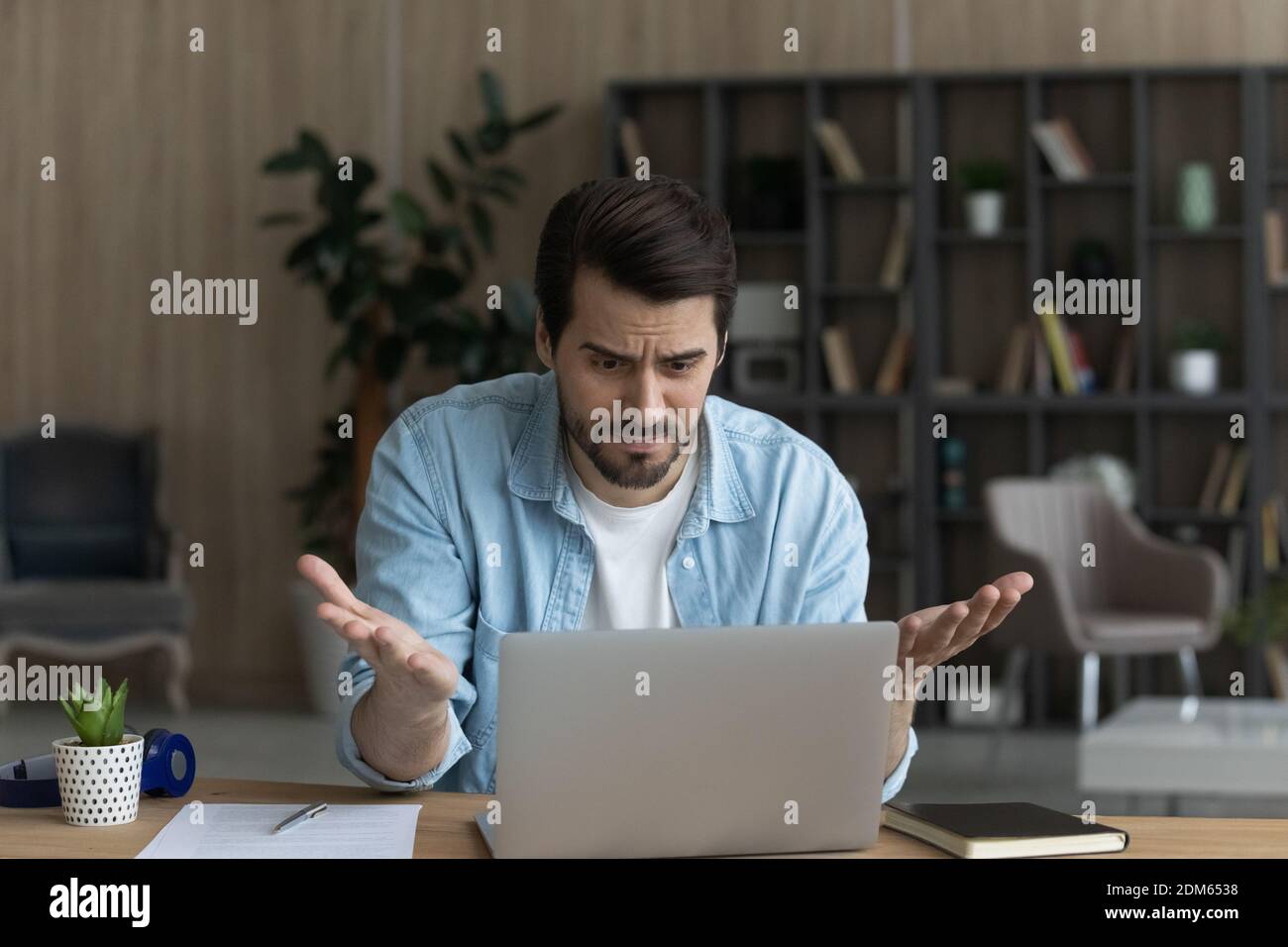 Unhappy man feel distressed with laptop problem Stock Photo - Alamy