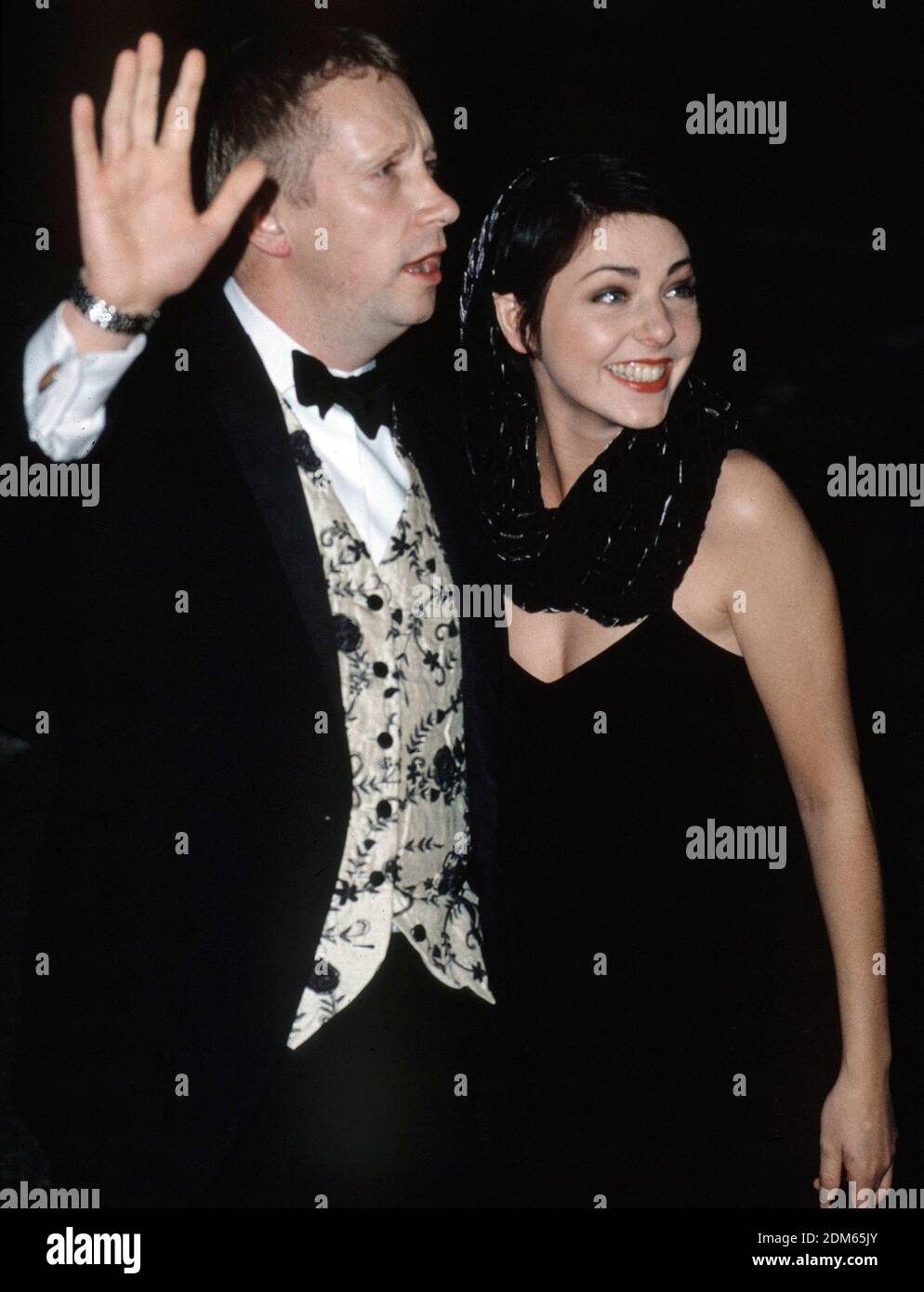 London, UK. LIBRARY. Mark Williams and guest (wife?) at a the premiere ...