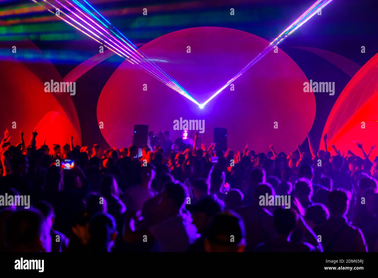 Crowd and DJs dancing during party Stock Photo - Alamy