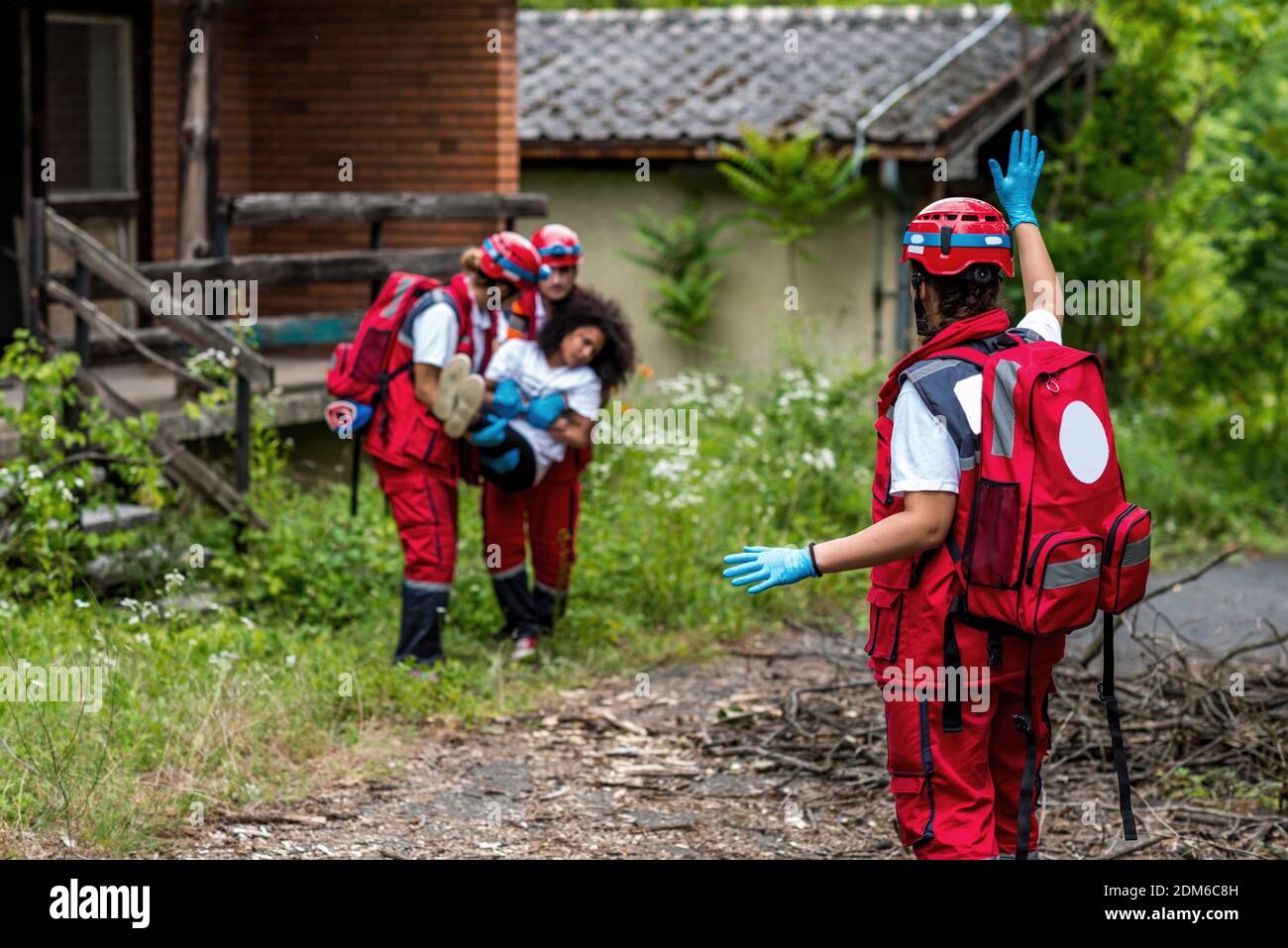 Carrying injured woman hi-res stock photography and images - Alamy