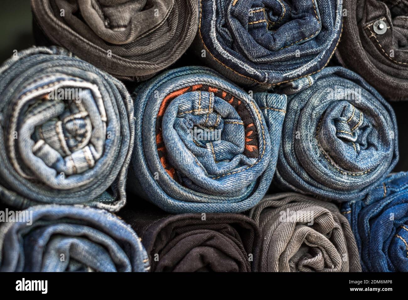 Blue denim rolled up jeans hi-res stock photography and images - Alamy