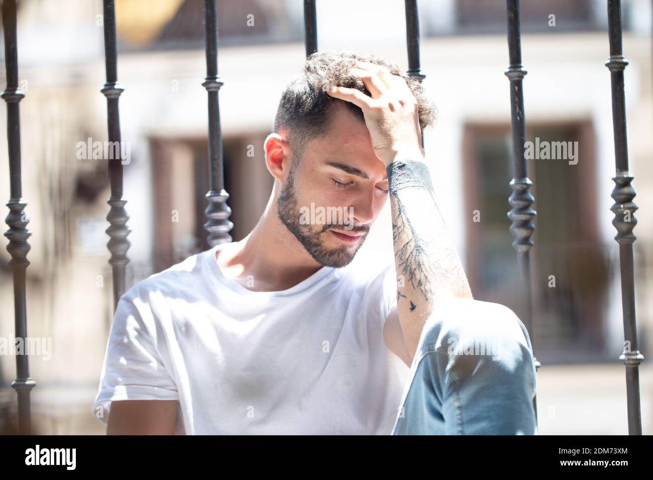 Man sitting head against hand hi-res stock photography and images - Alamy