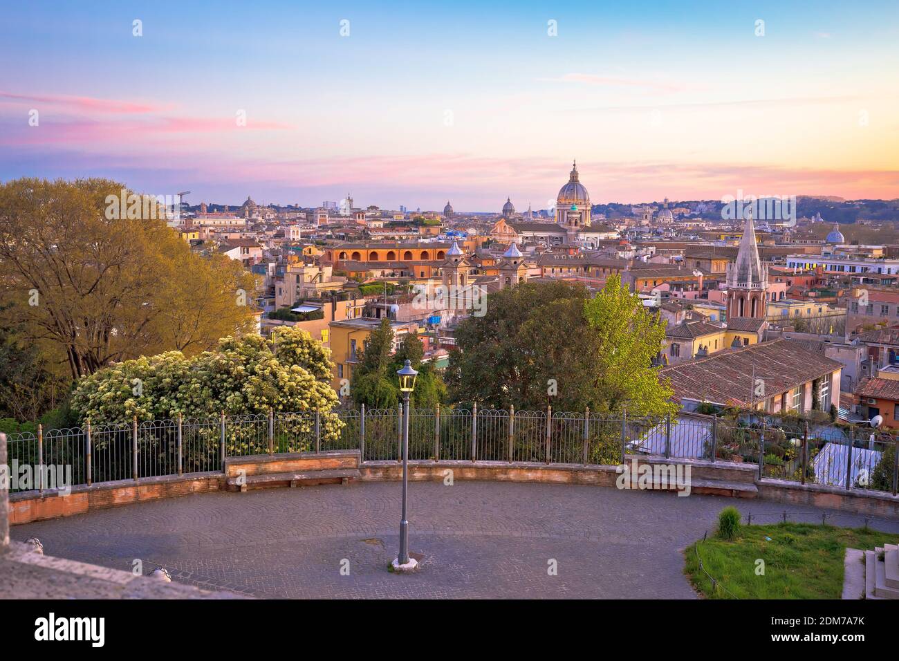 Eternal city of Rome. Rome rooftops and landmarks colorful sunset view, capital city of Italy ...