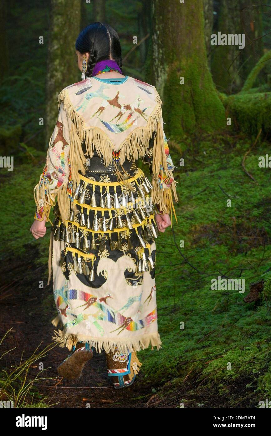 Indigenous woman wearing ornate traditional dress in forest Stock Photo ...