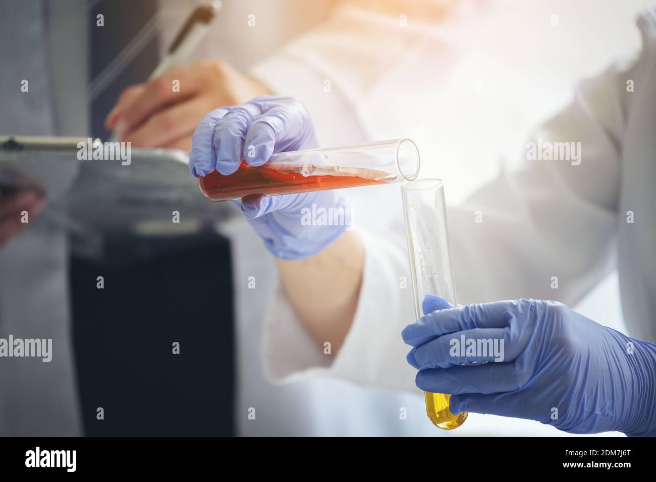 Scientist mixing chemicals hi-res stock photography and images - Alamy