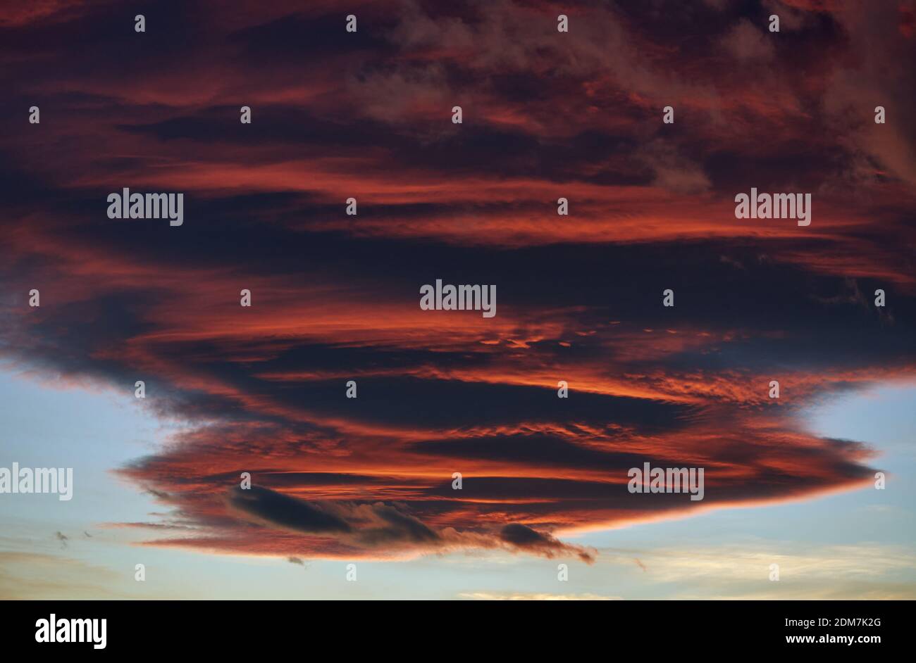 A beautiful dark orange cloud column on a sunset sky Stock Photo - Alamy