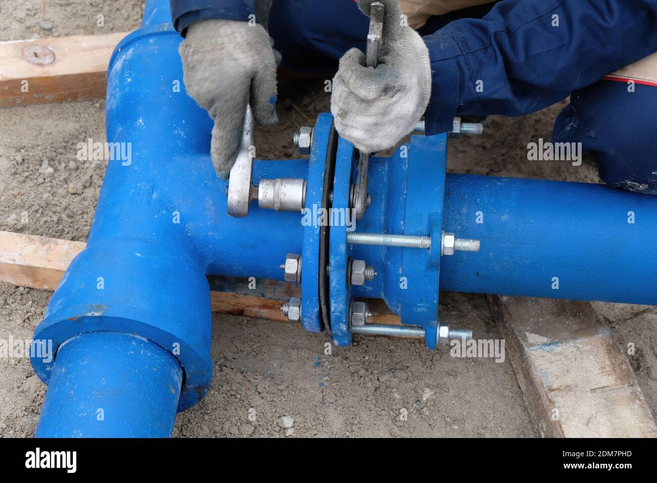 Workers installing water supply pipeline system, close up Stock Photo ...