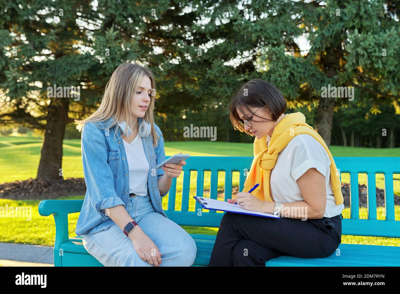 Female social worker, psychologist, journalist, recording interviewing ...