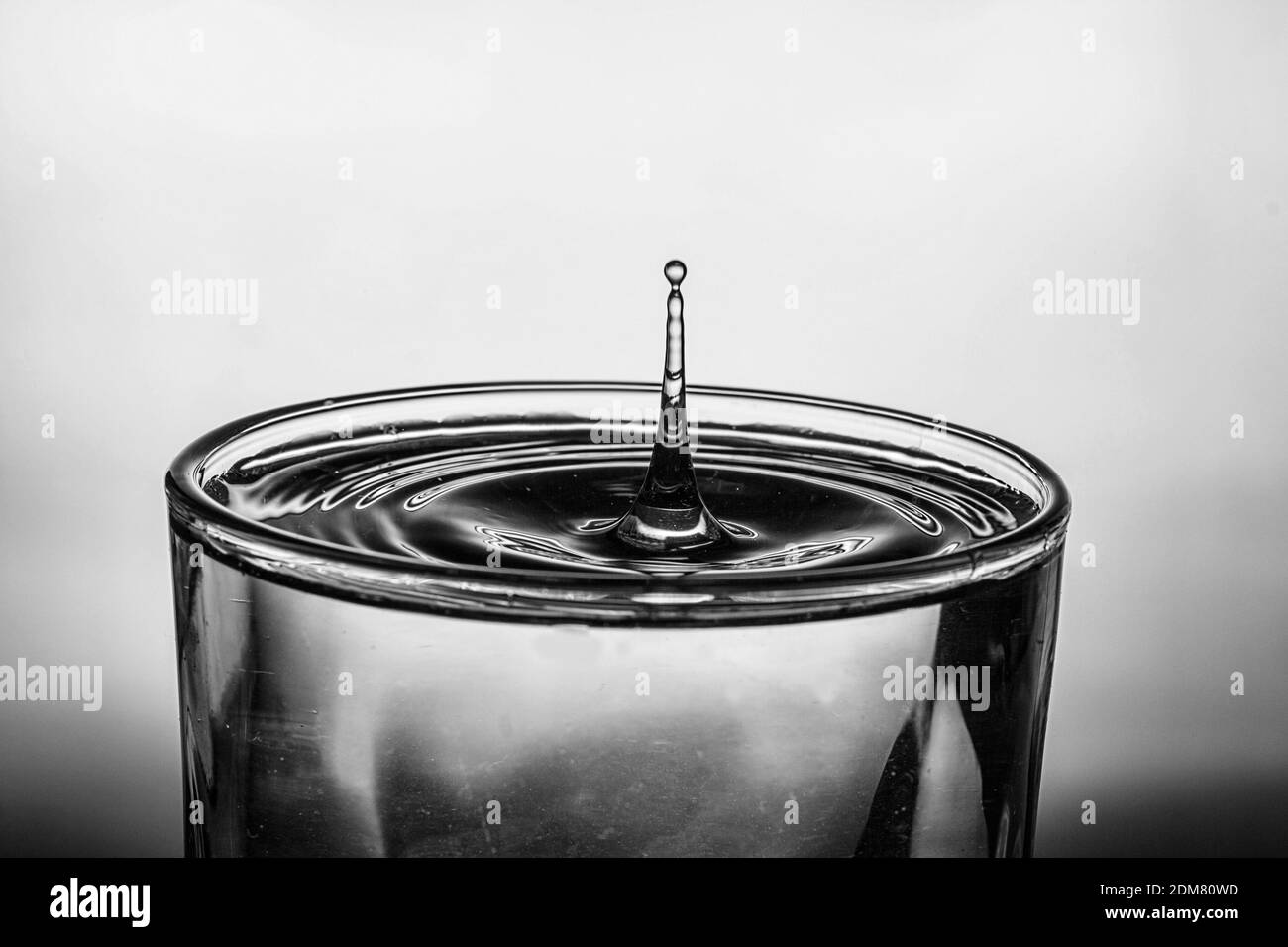 Shot water falling glass Black and White Stock Photos & Images - Alamy