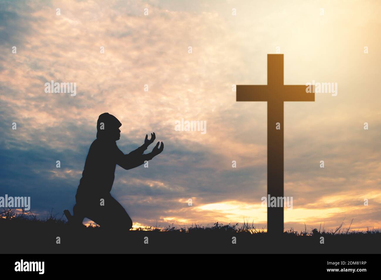 Kneeling at cross hi-res stock photography and images - Alamy