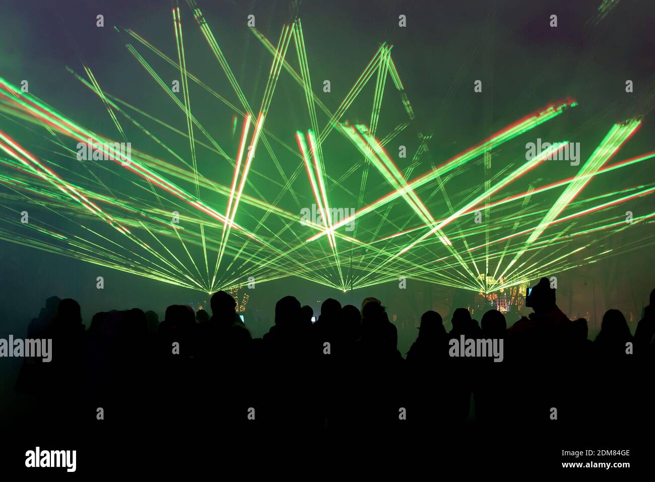 Colorful laser show at night with audience Stock Photo - Alamy