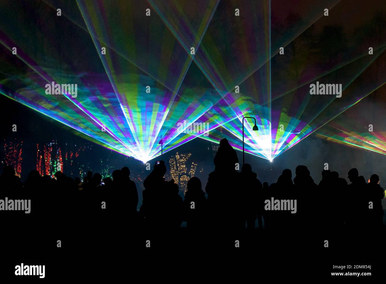 Colorful laser show at night with audience Stock Photo - Alamy