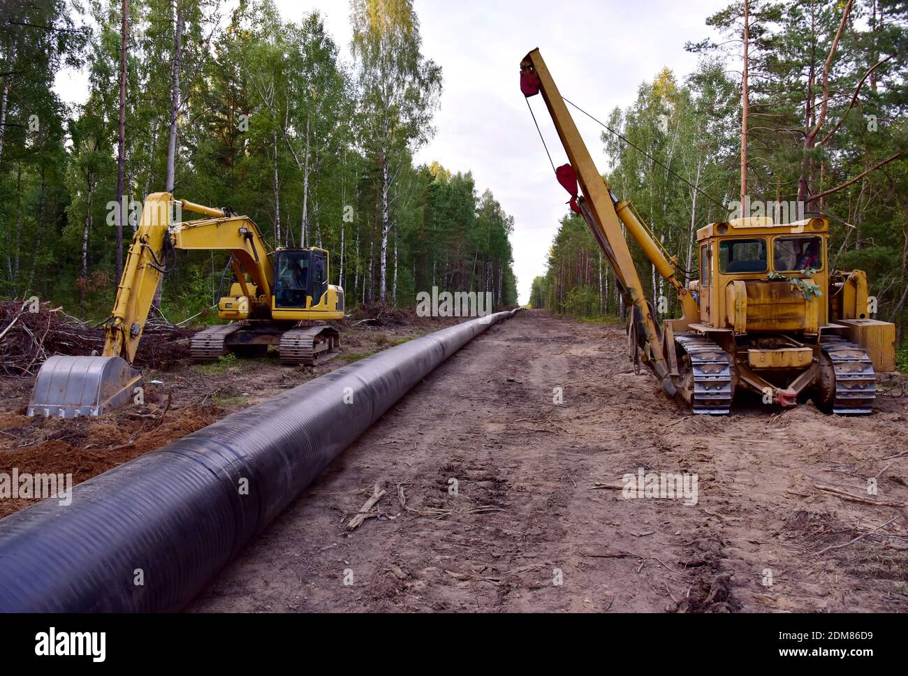 Excavator and Pipelayer with side boom o Installation of gas and crude ...
